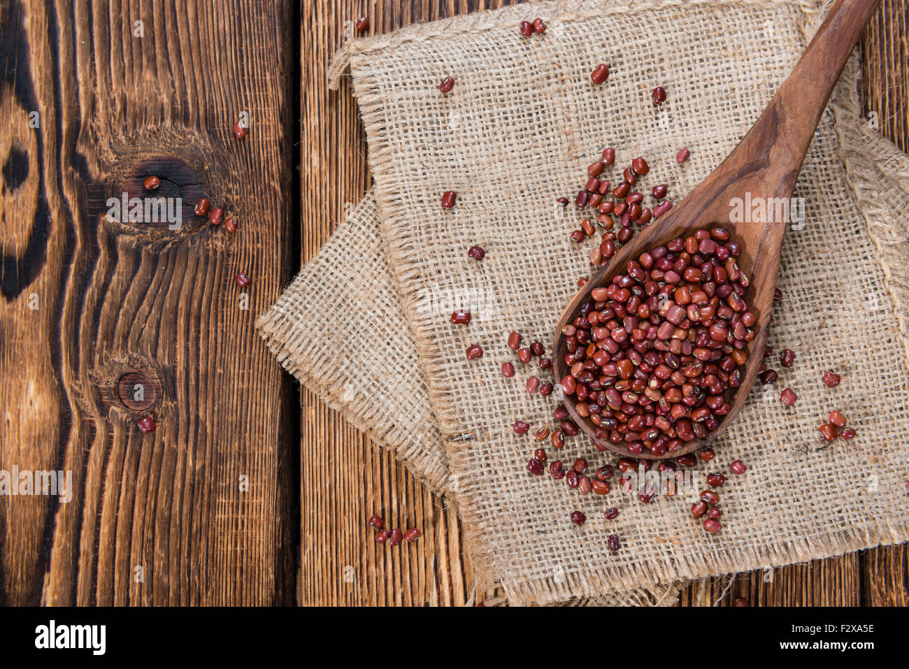 Dried red beans on dark rustic wooden background Stock Photo - Alamy