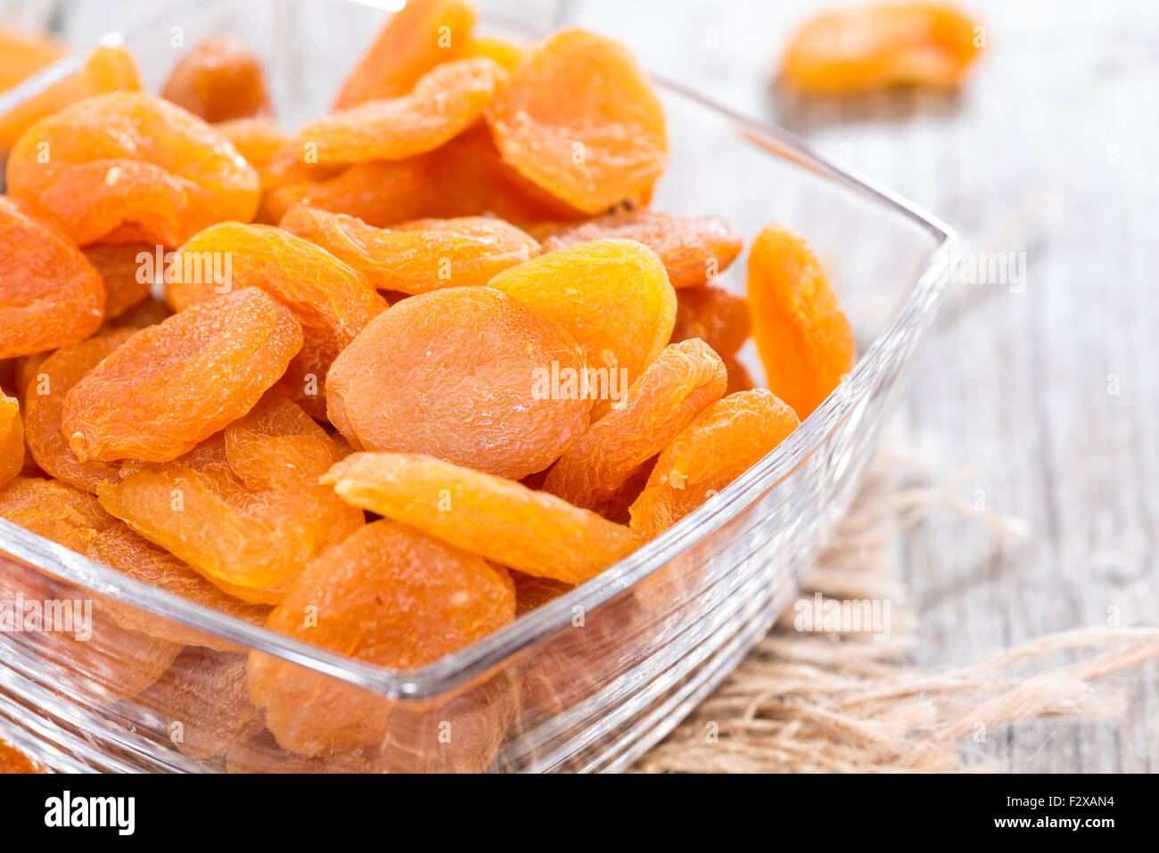 Dried apricots on yellow hi-res stock photography and images - Alamy