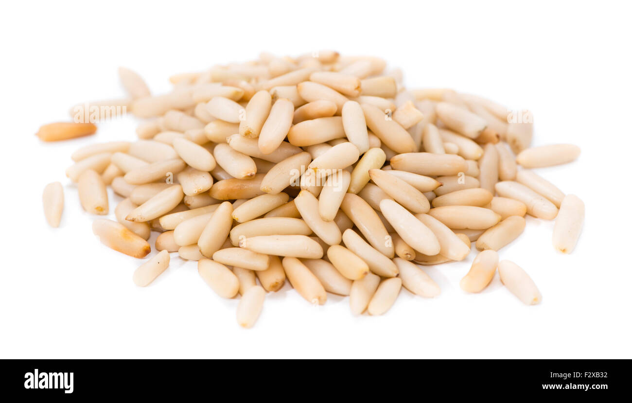 Heap of fresh Pine Nuts isolated on pure white background Stock Photo ...