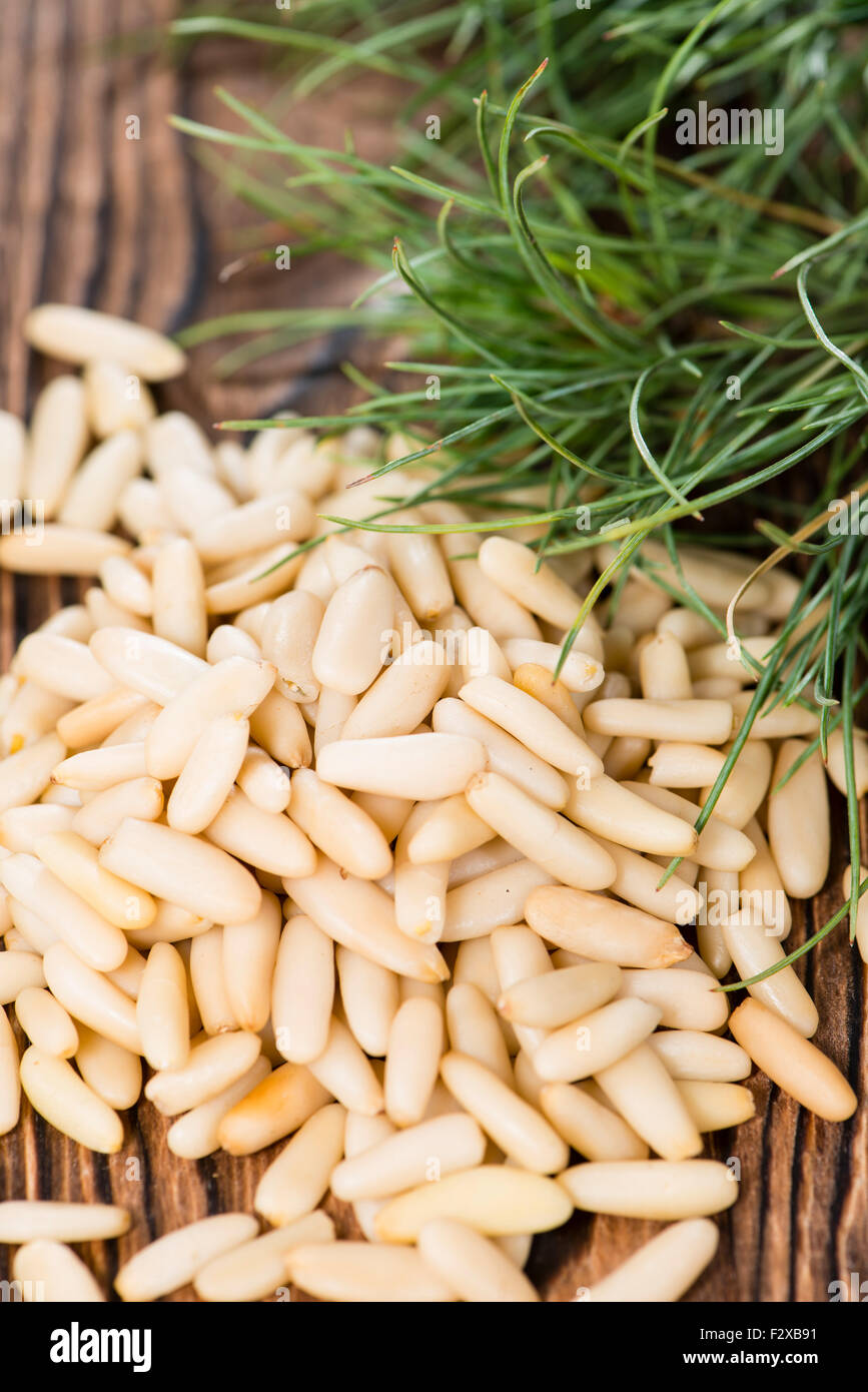 Some fresh Pine Nuts on dark vintage wooden background Stock Photo - Alamy