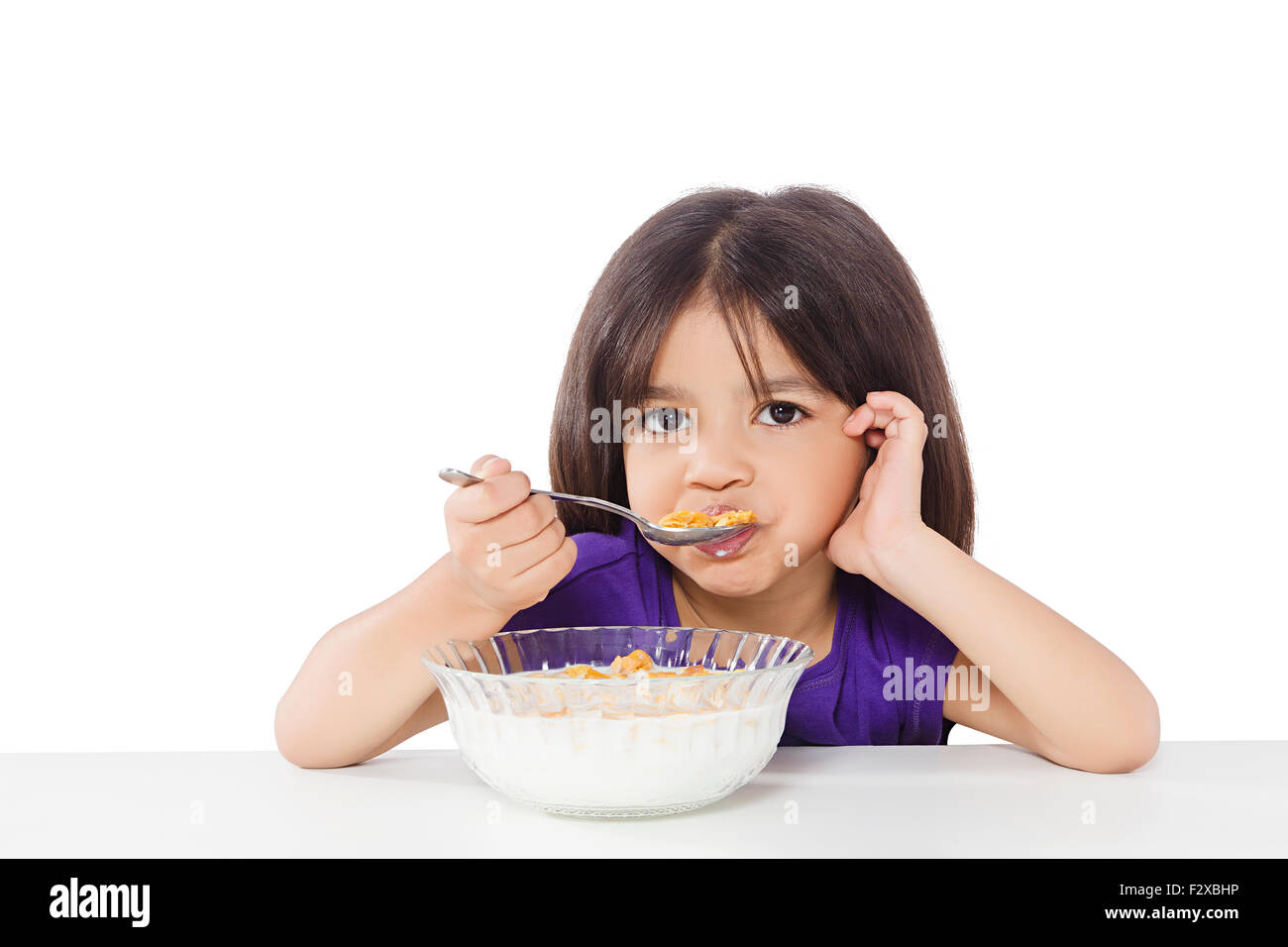 1 indian Kid girl Breakfast Eating Corn Flakes Stock Photo - Alamy