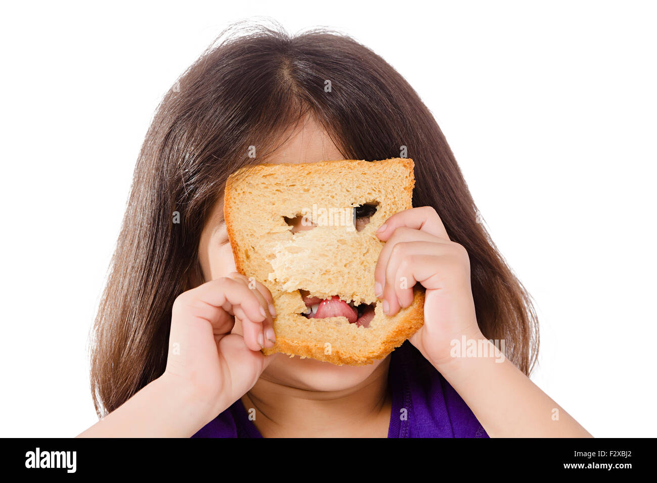 1 indian kid girl eating Bread Mischief Stock Photo - Alamy