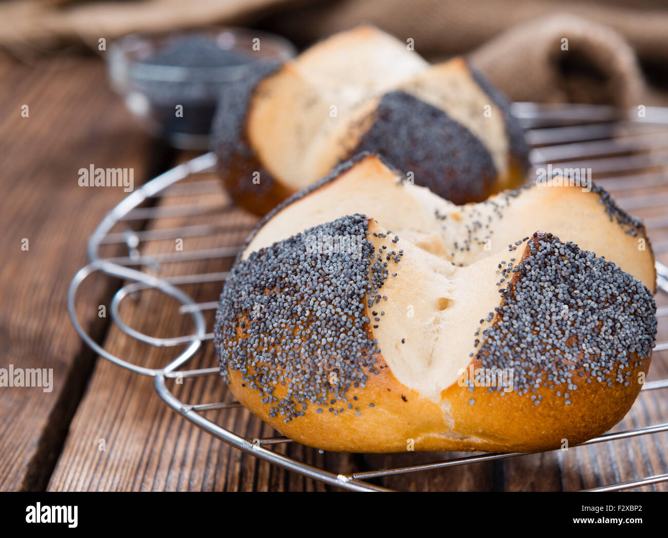 Fresh baked Pretzel Roll with Poppyseed (close-up shot Stock Photo - Alamy