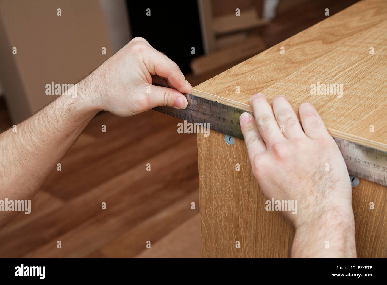 Hands with a ruler Stock Photo - Alamy