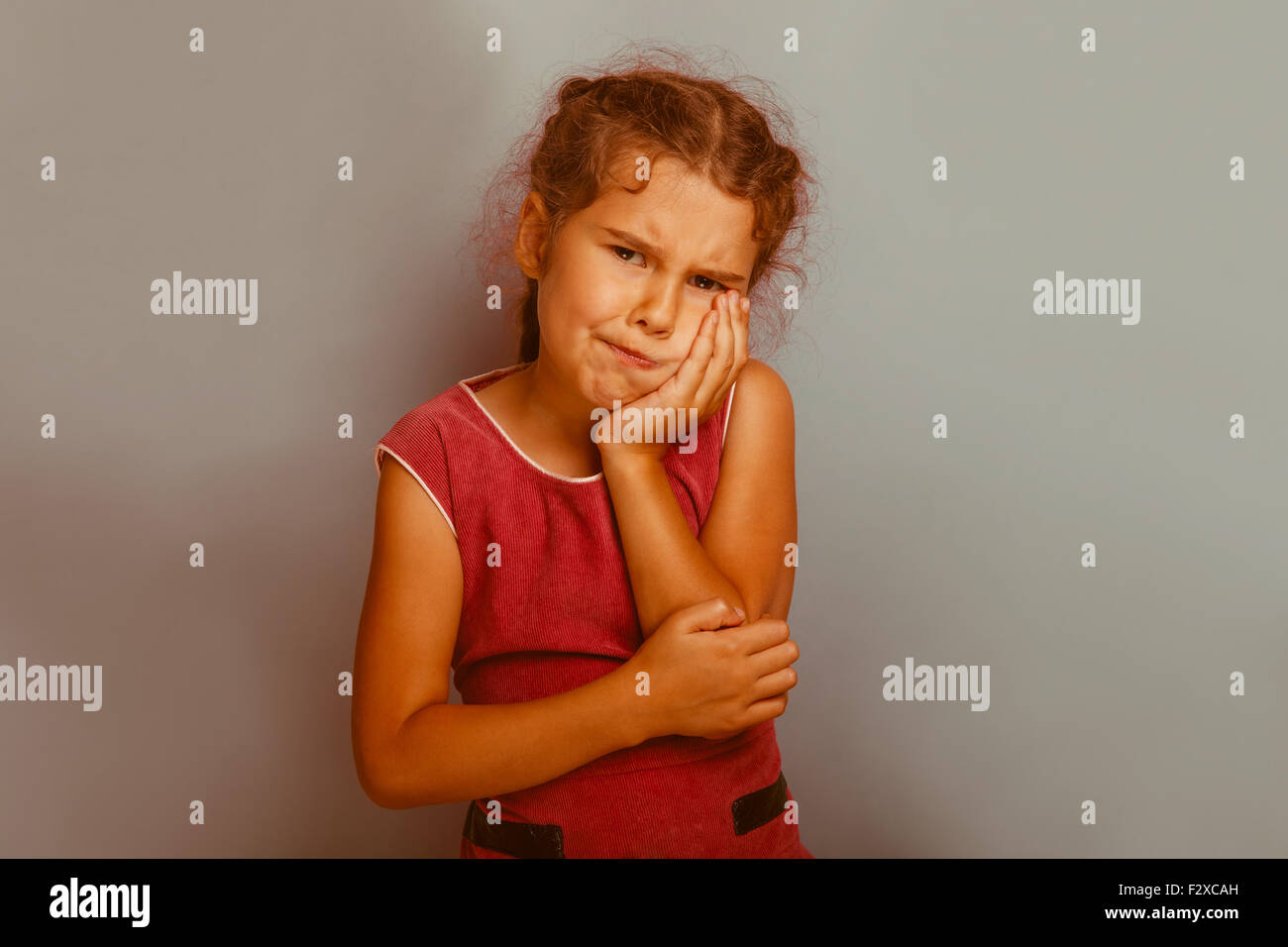 Girl European appearance decade toothache on blue background retro ...