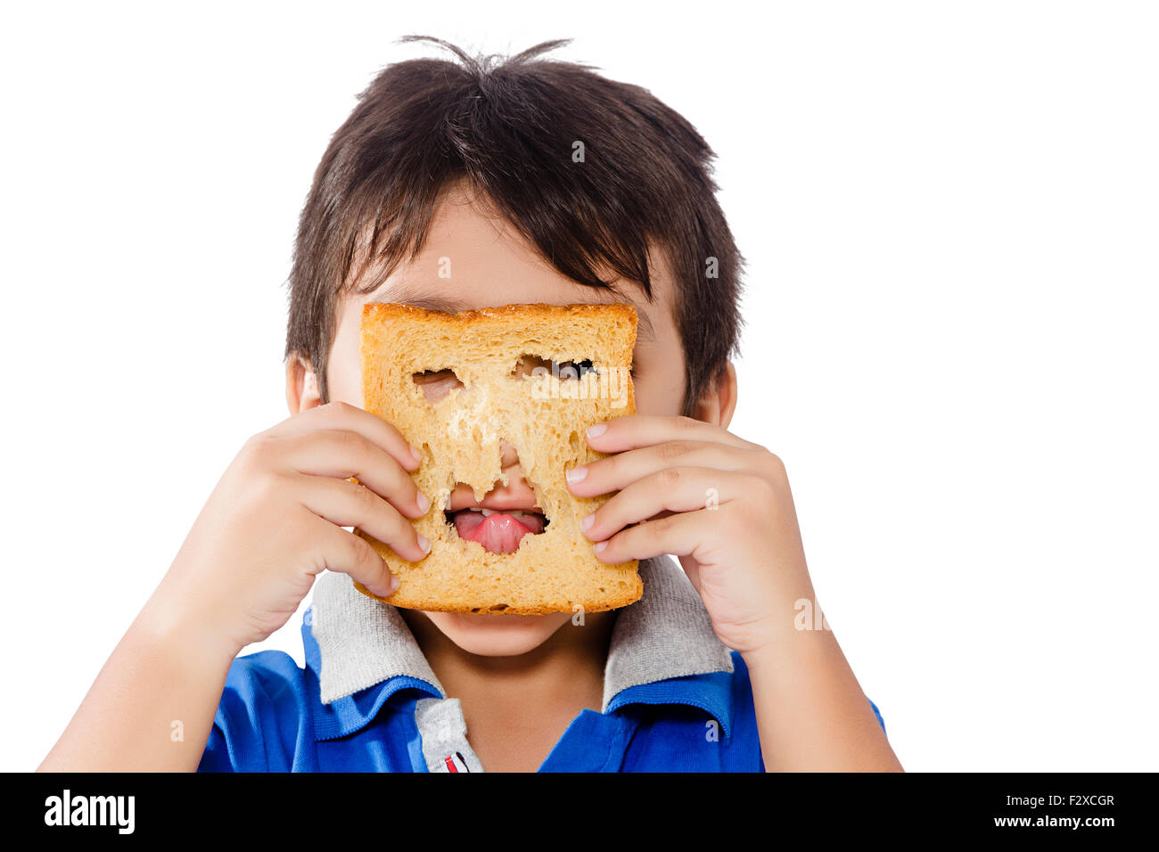 1 indian kid boy eating Bread Mischief Stock Photo - Alamy