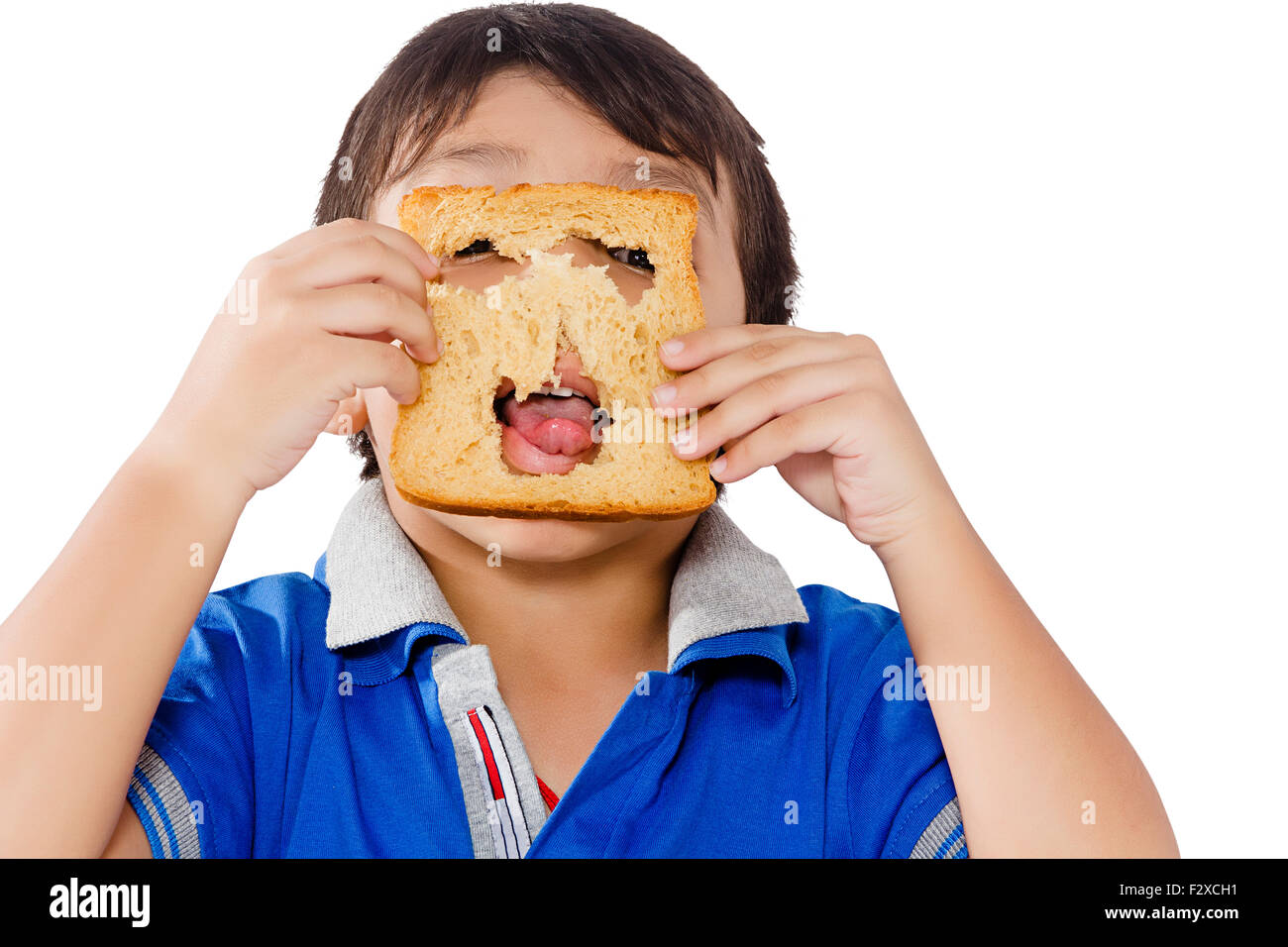 1 indian kid boy eating Bread Mischief Stock Photo - Alamy
