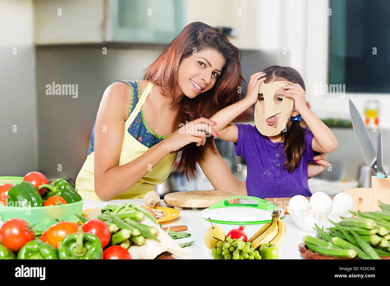 2 indian Mother and kid daughter Kitchen Cooking Stock Photo - Alamy