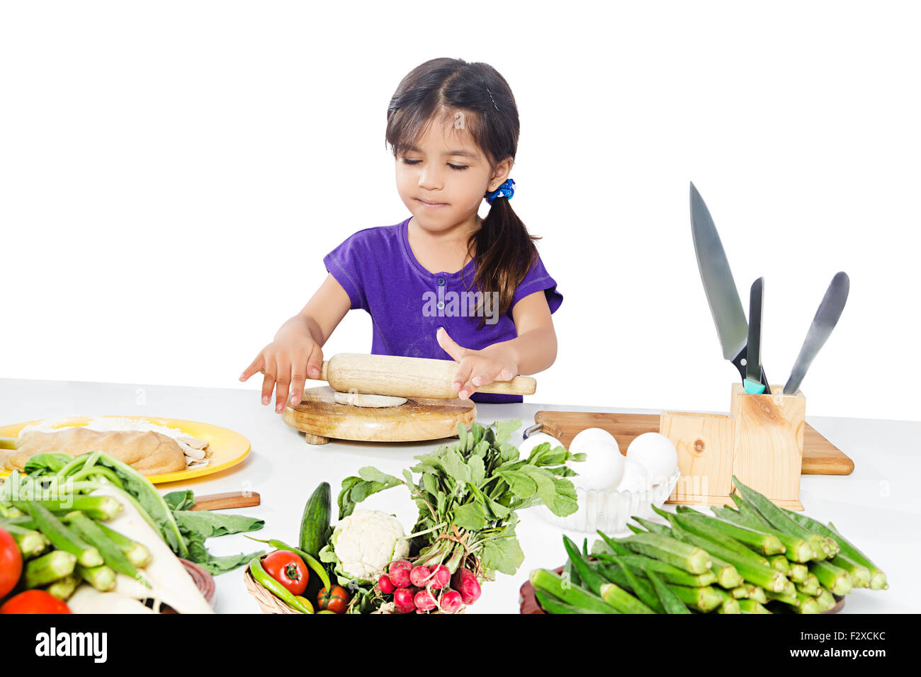 Indian cooking with children hi-res stock photography and images - Alamy