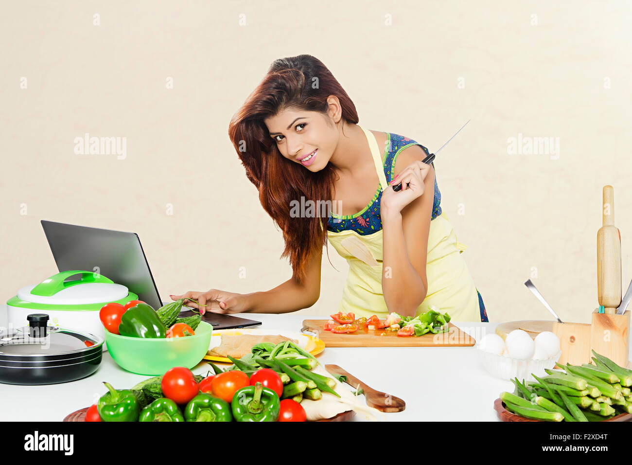 Multitasking woman cooking hi-res stock photography and images - Alamy