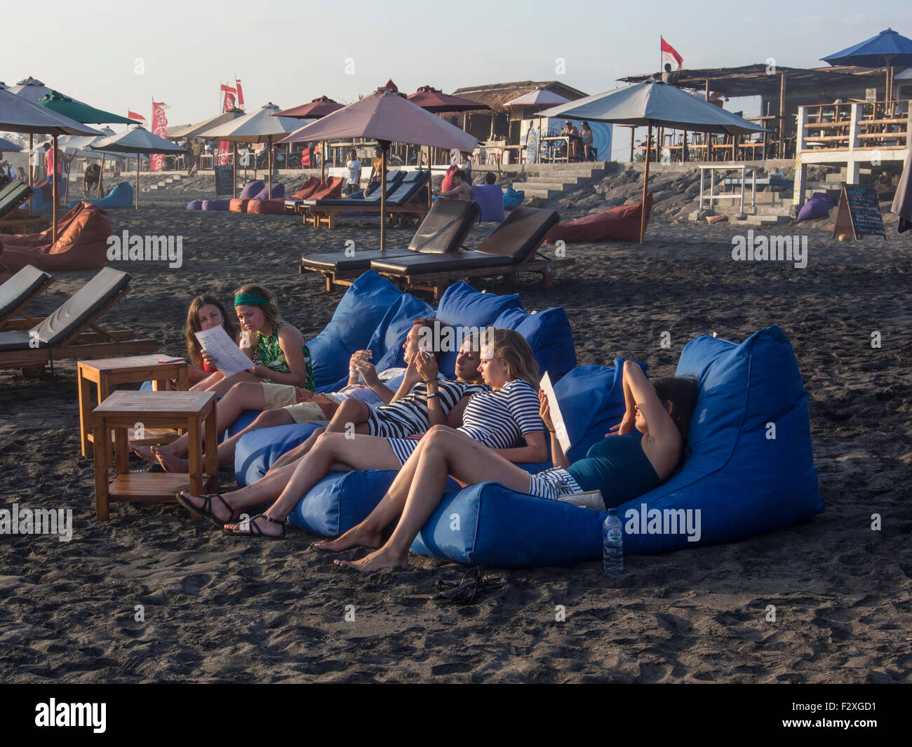 Tourist on a beach in Bali, Indonesia Stock Photo - Alamy
