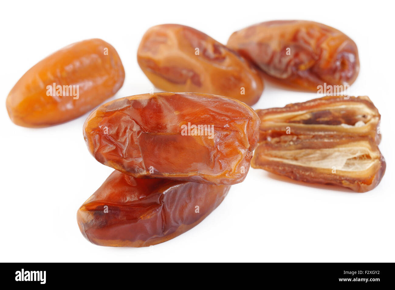 Dried dates isolated on white background Stock Photo - Alamy