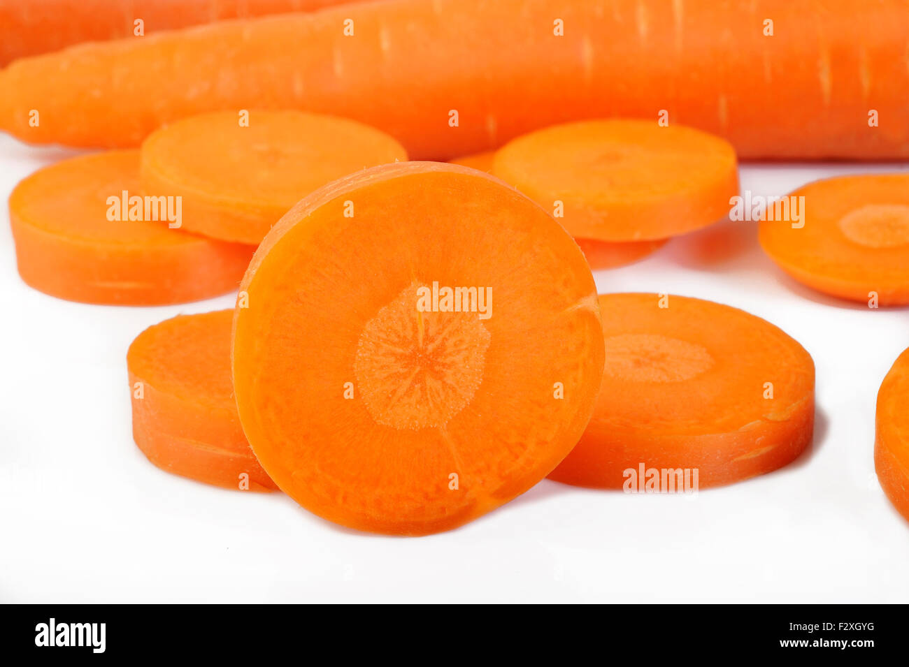 Fresh slice carrots on white background Stock Photo - Alamy