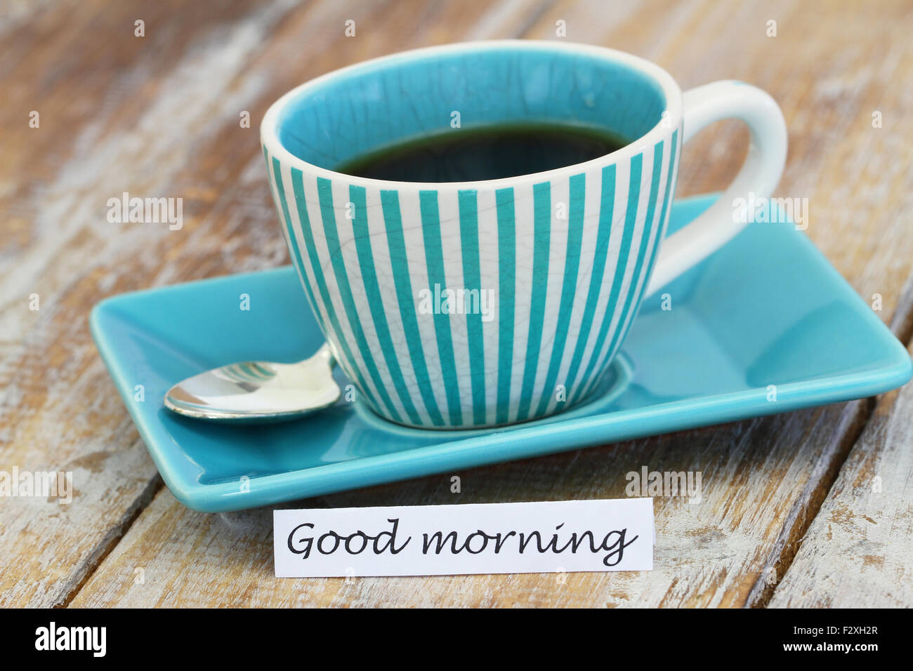 Good morning card with cup of espresso coffee on rustic wooden surface ...