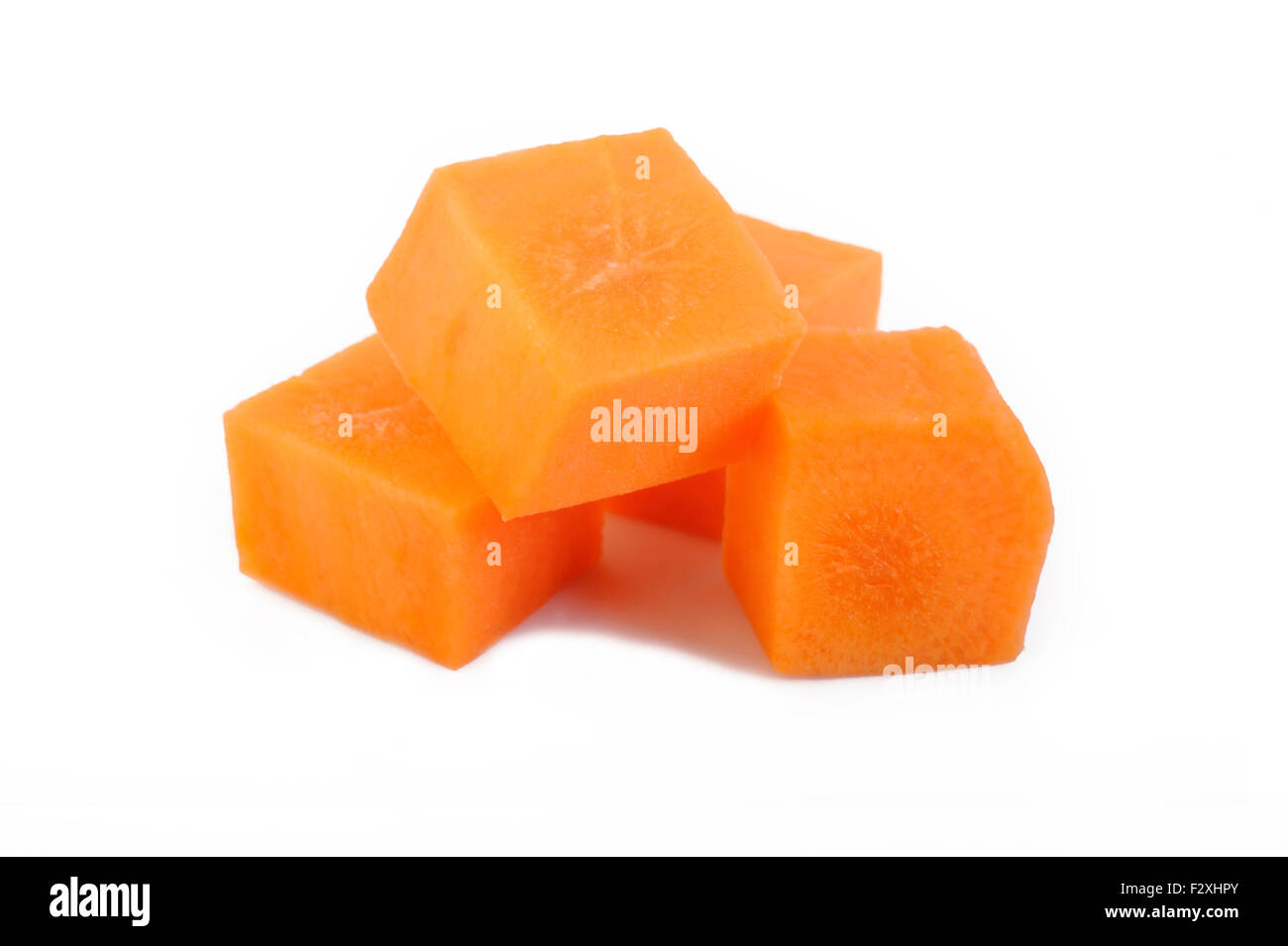 Carrot cube isolated on white background Stock Photo - Alamy