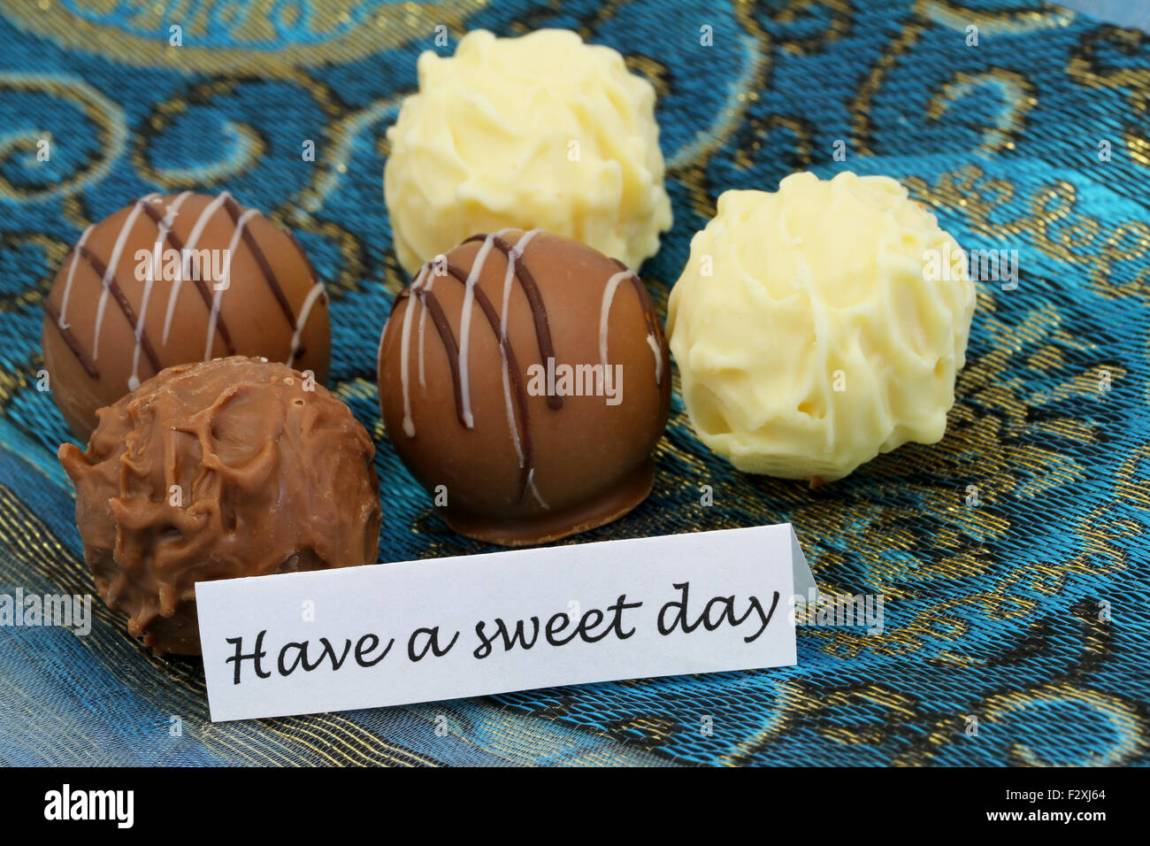 Have a sweet day card with assorted chocolates Stock Photo - Alamy