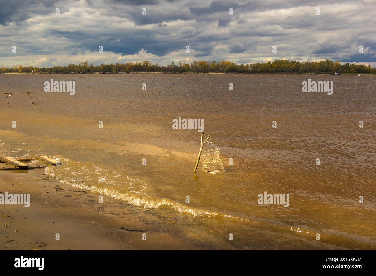 Spinning and tank set on wooden Raguli on the river bank Stock Photo ...