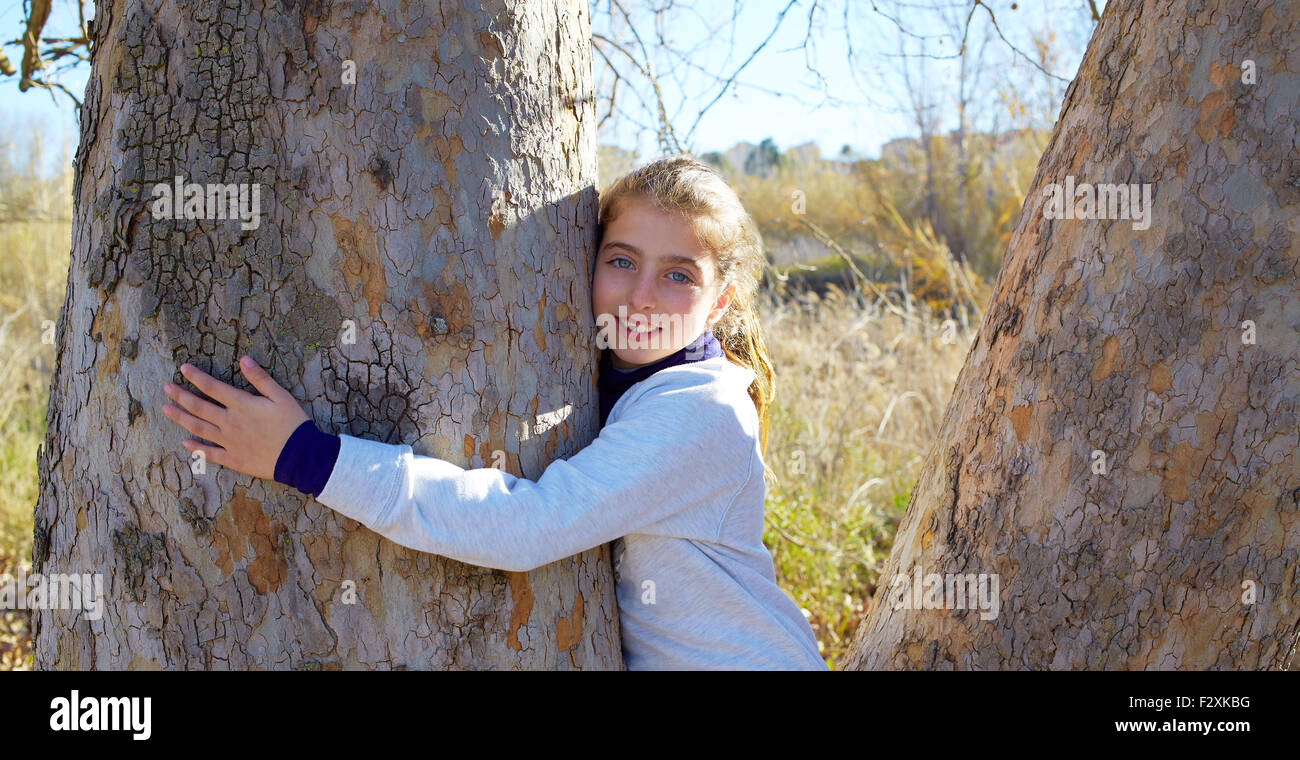 Children hug tree autumn hi-res stock photography and images - Alamy