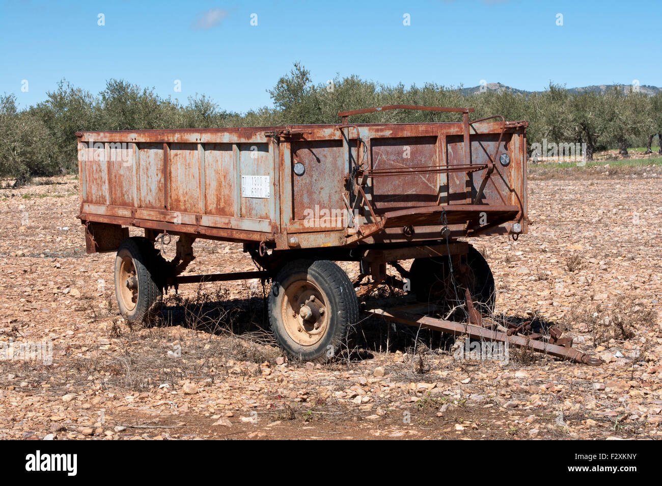 Old farm trailer on a fallow field Stock Photo - Alamy