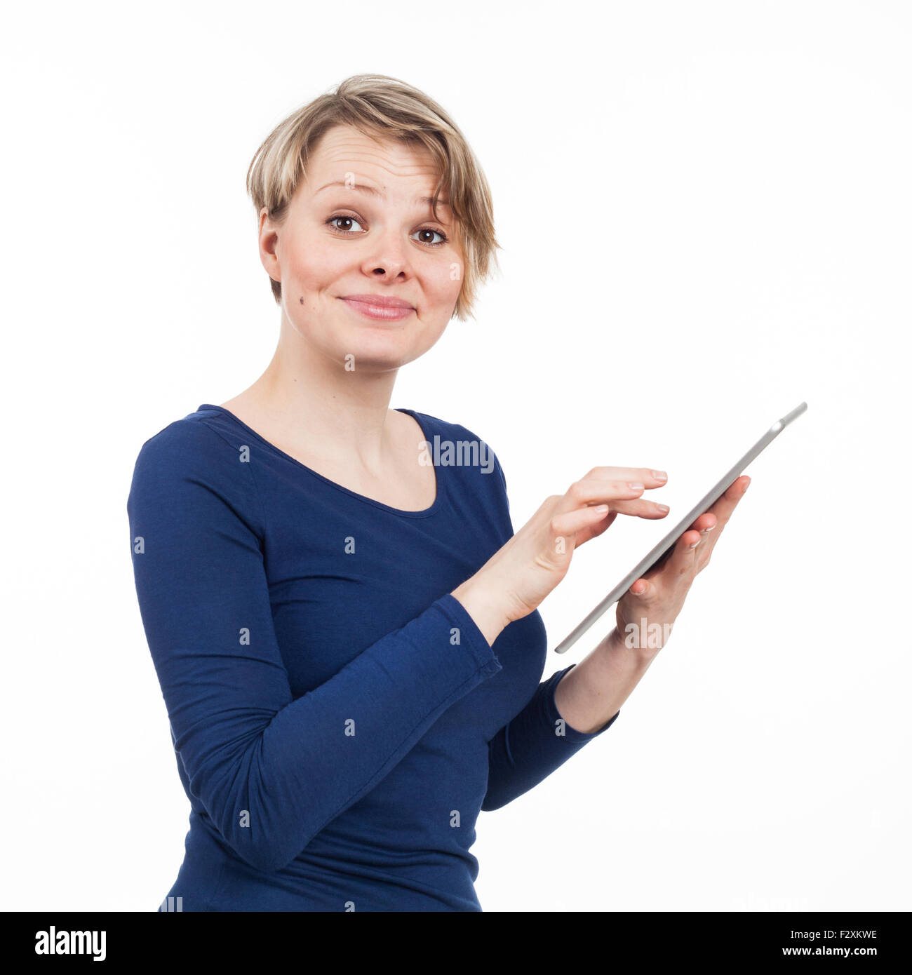 Young woman using an electronic tablet, isolated on white Stock Photo ...