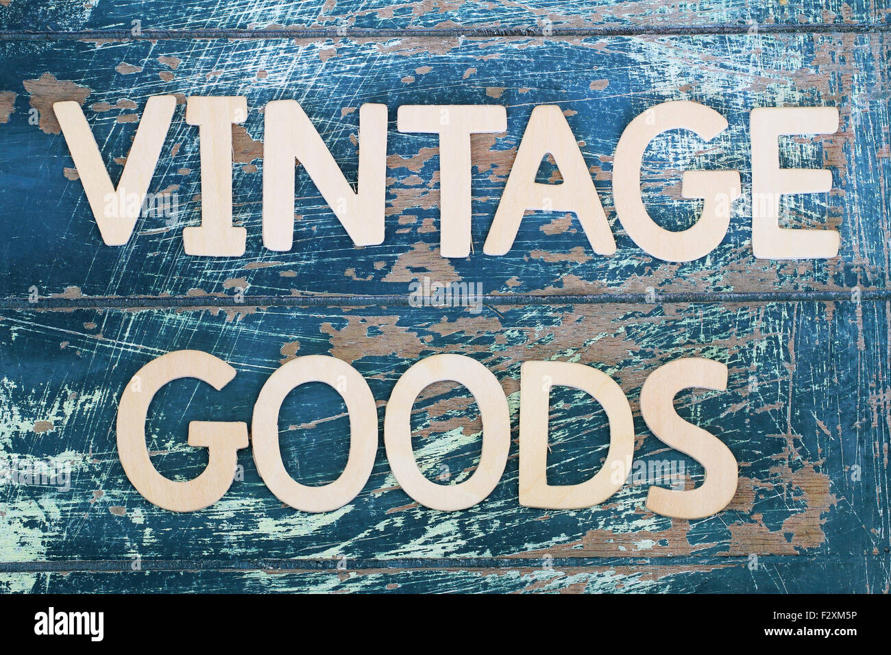 Vintage goods written with wooden letters on rustic wooden surface ...