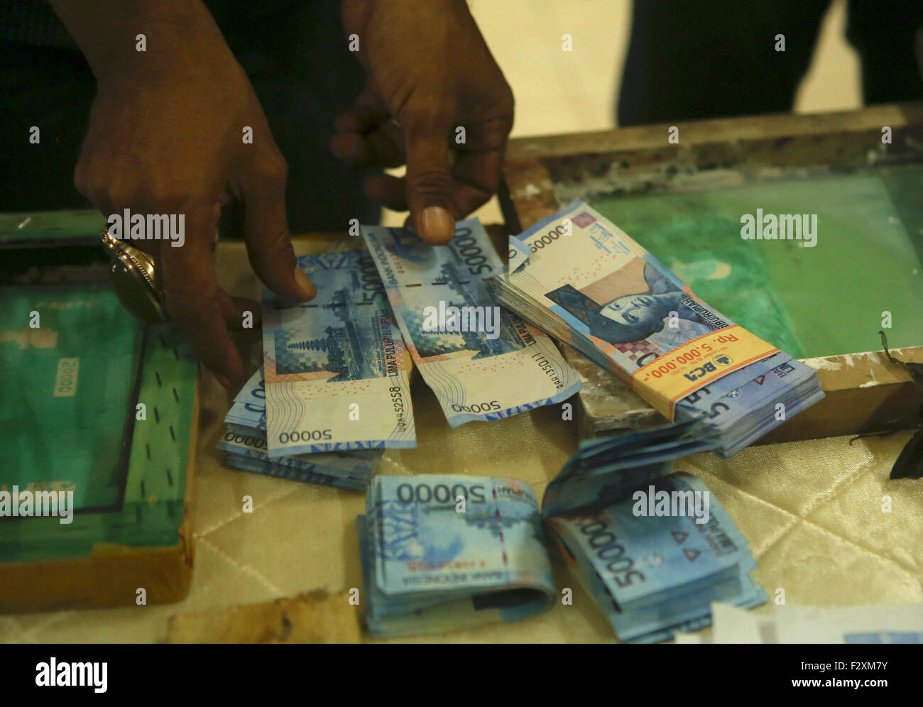 Evidence Money Fractions 50000 rupiah forged Stock Photo - Alamy