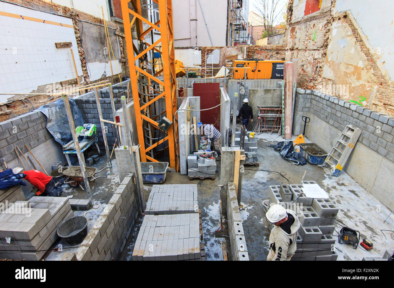 construction workers on building construction site Stock Photo - Alamy
