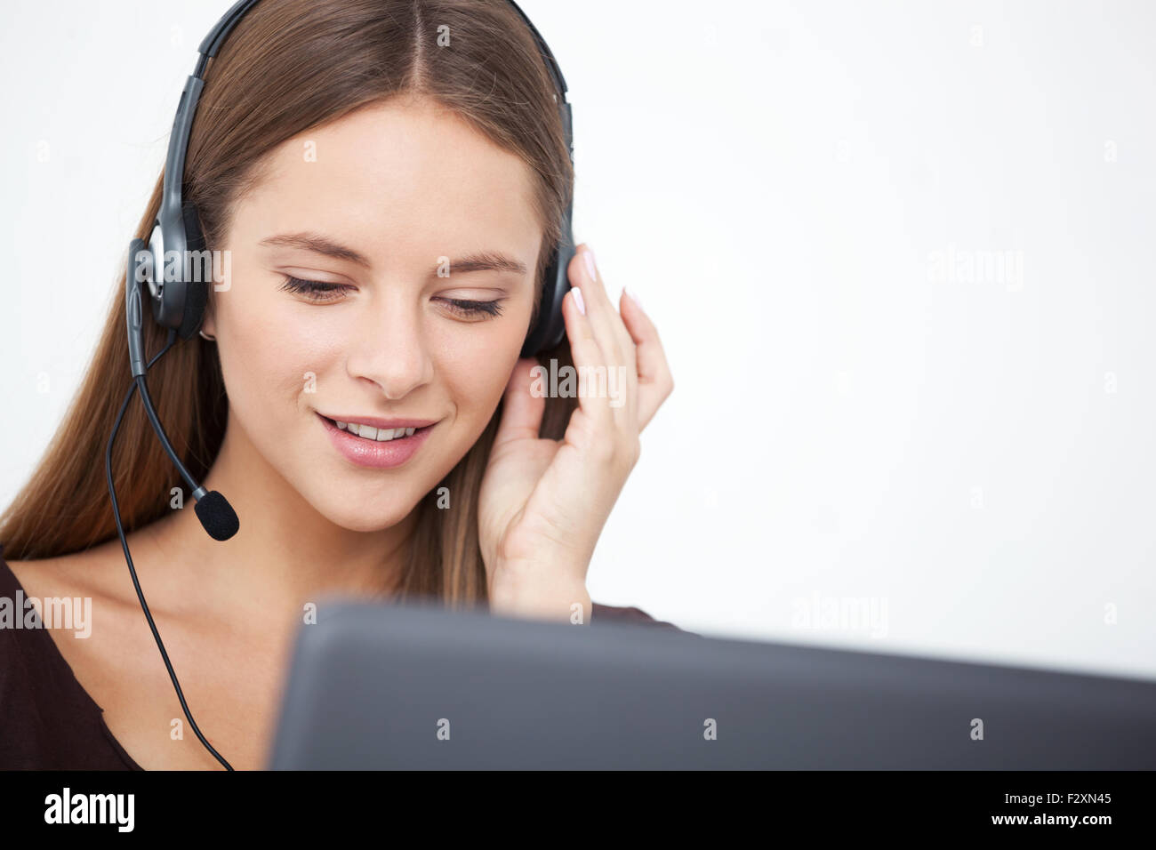 Portrait of happy cheerful beautiful young support phone operator with headset Stock Photo - Alamy