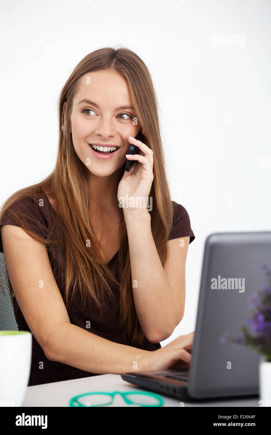 Portrait of young beautiful business woman working at her office Stock Photo - Alamy