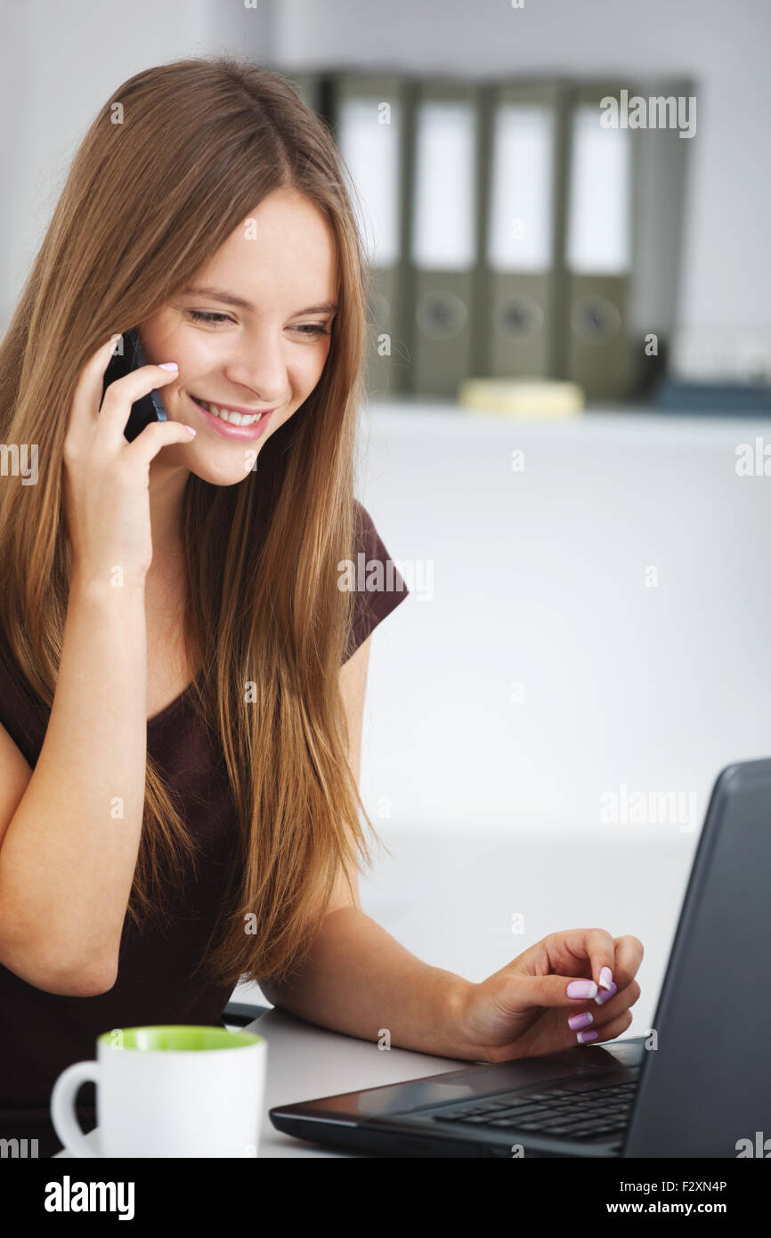 Portrait of young beautifull business woman working at her office Stock ...