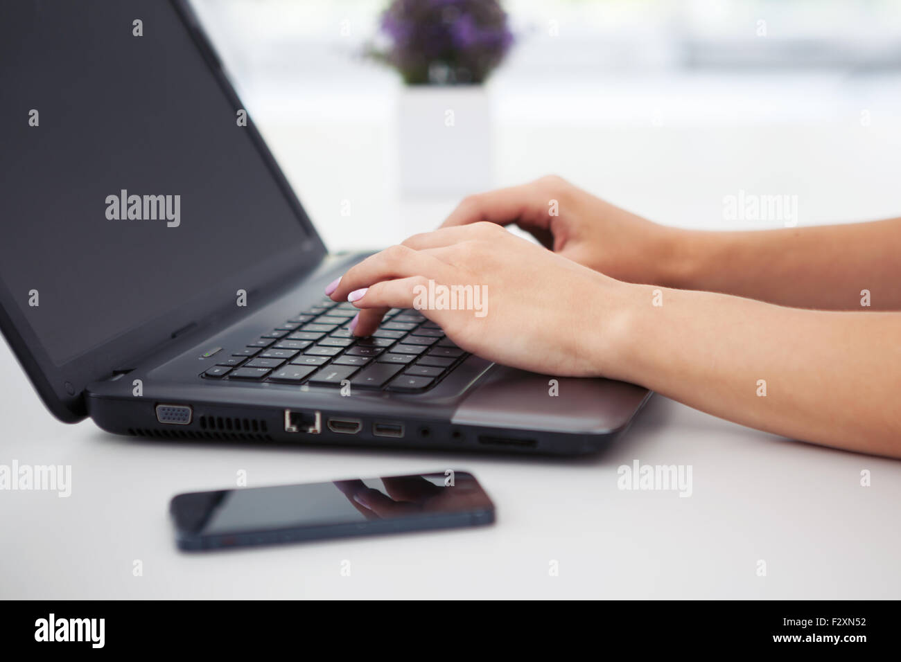 This is Closeup of woman hands working with laptop Stock Photo - Alamy