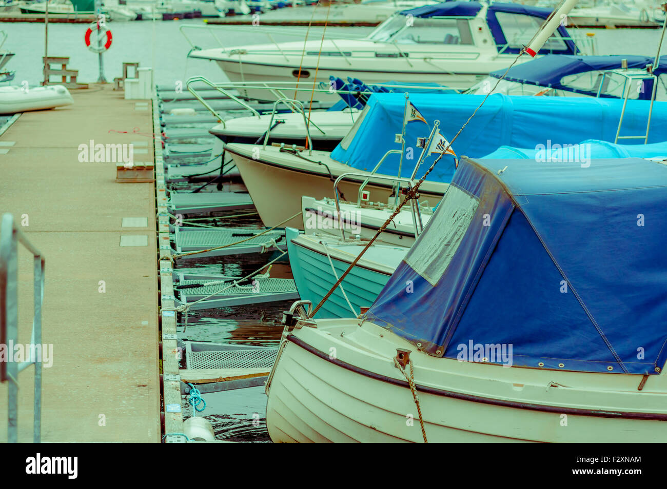 Boats lined up in a dock Stock Photo - Alamy