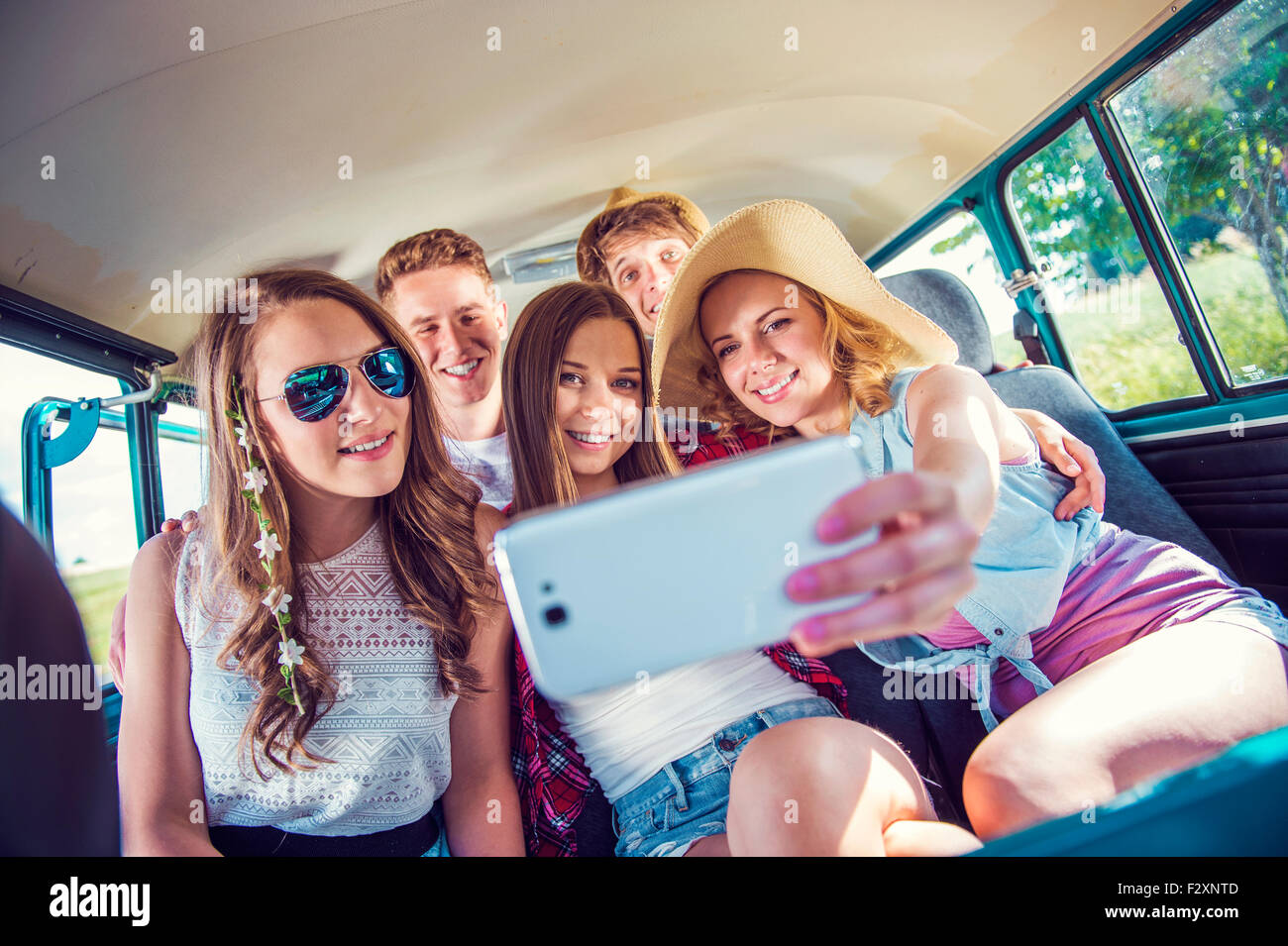 Young hipster friends on a road trip on a summers day Stock Photo - Alamy