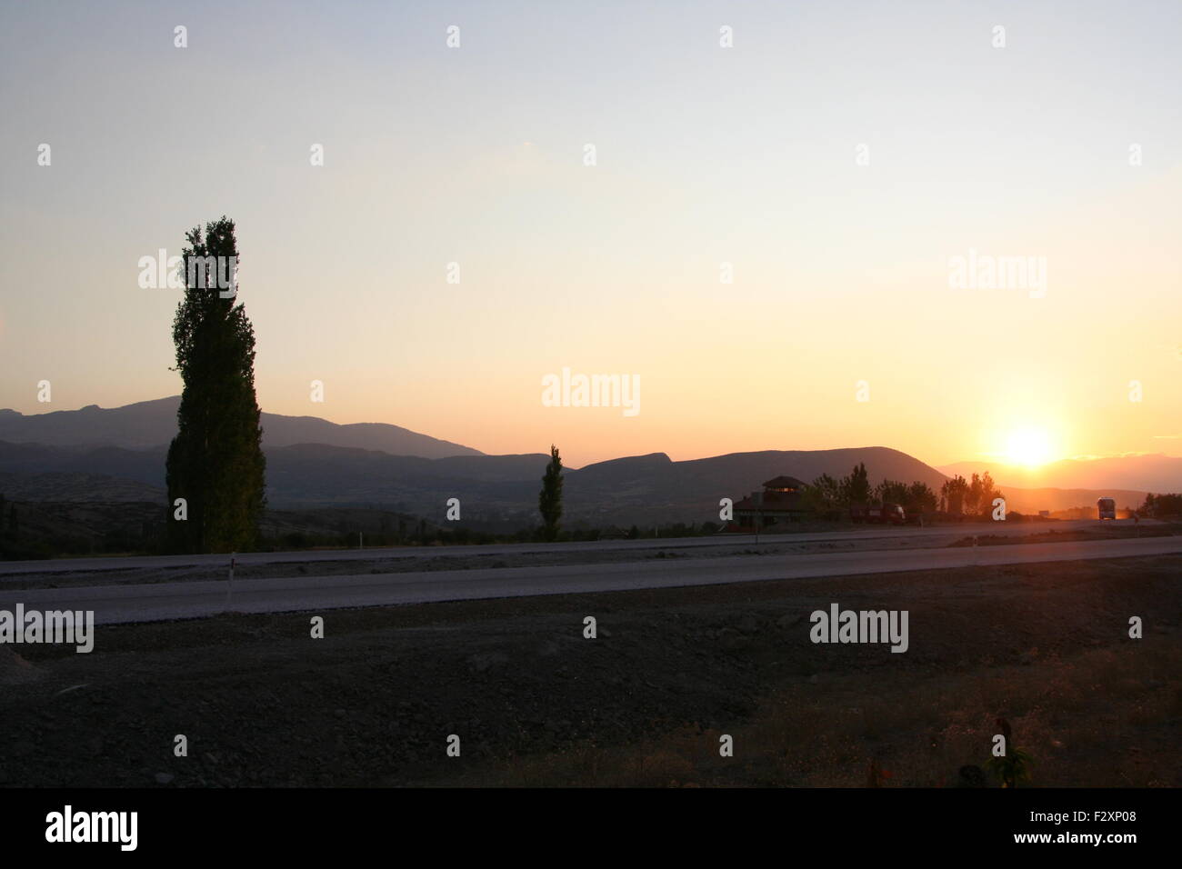 Countryside road red sunset landscape in Turkey Stock Photo - Alamy