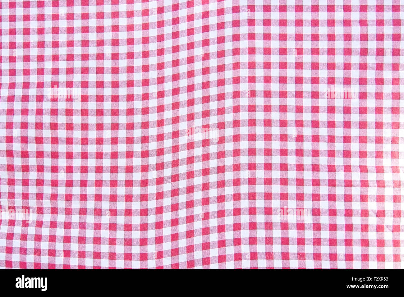 Red and white checkered table cloth fabrics background Stock Photo - Alamy
