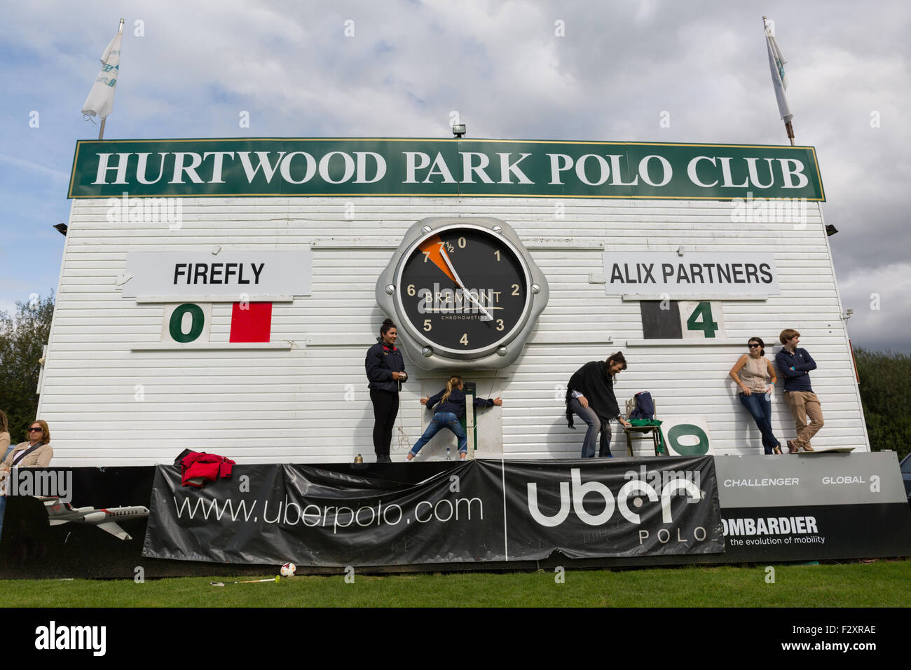 Scoreboard operators at Hurtwood Park polo club Stock Photo - Alamy