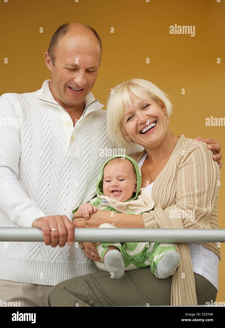 Grandparents with his grandchild Stock Photo - Alamy