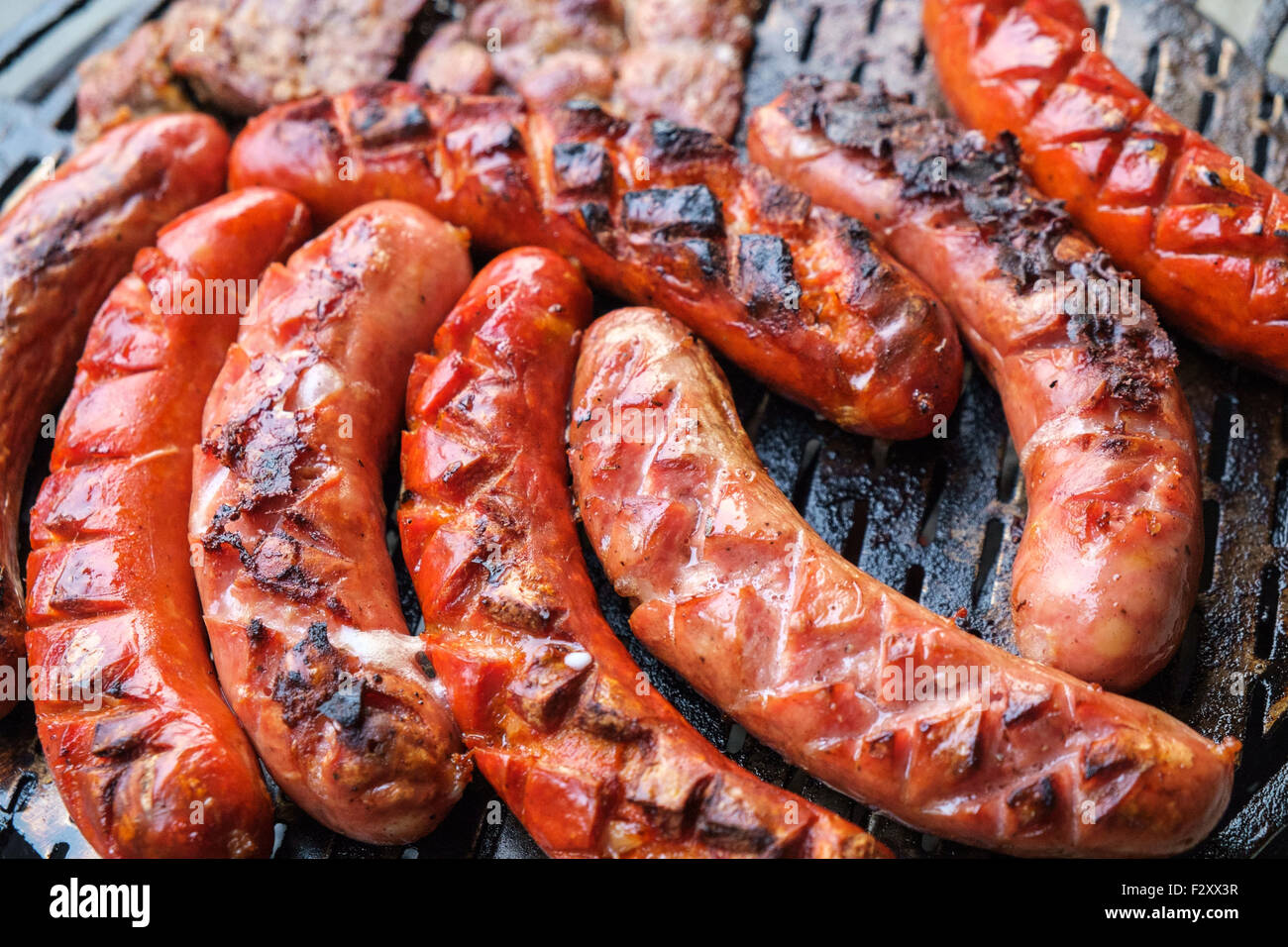 Sausages cooking on outdoor grill hi-res stock photography and images ...