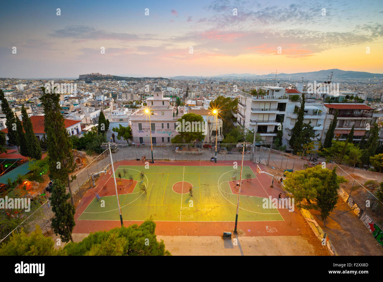 View of Athens and Acropolis from Strefi Hill. Basketball playground in ...