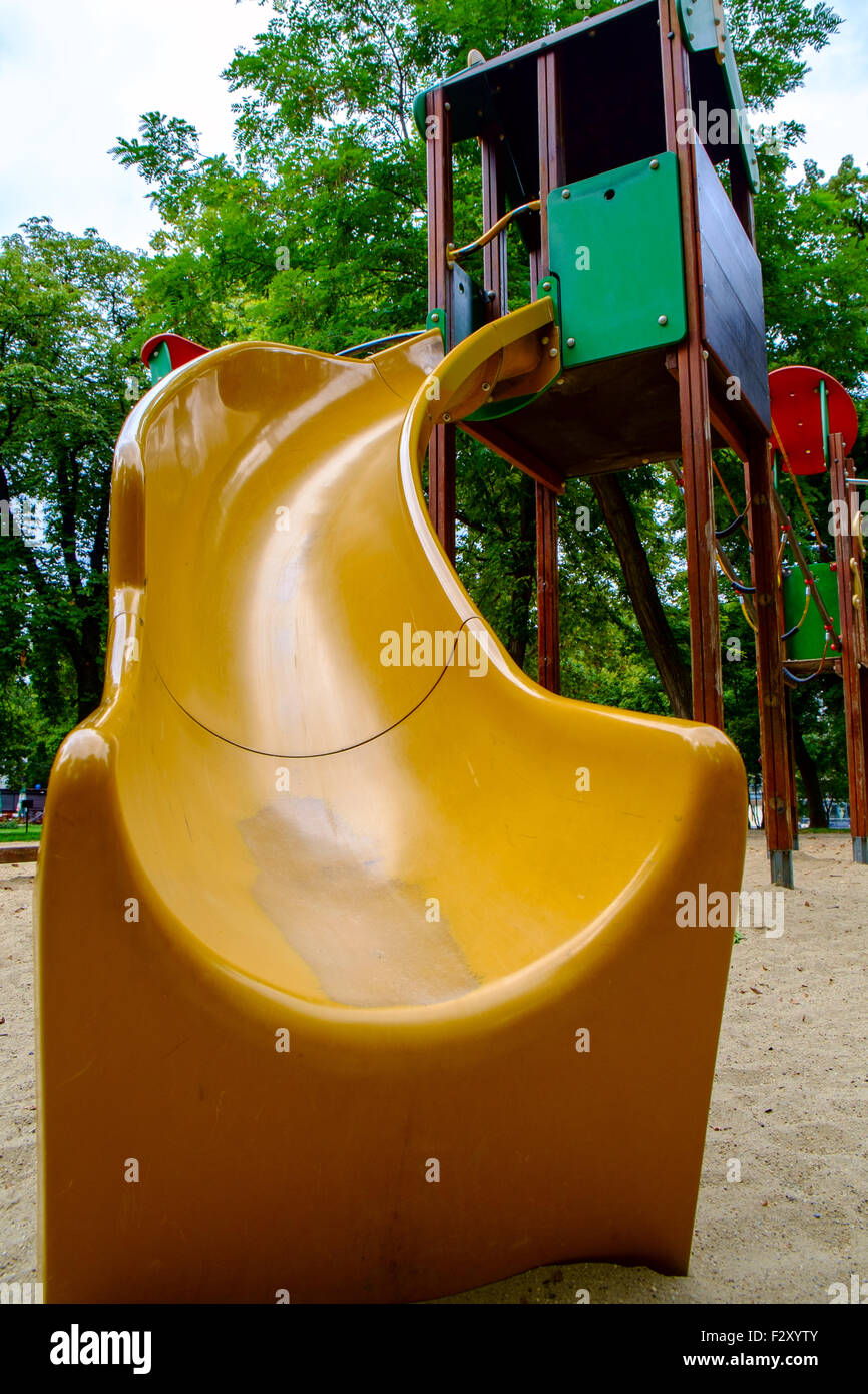 Empty children slide in public park Stock Photo - Alamy