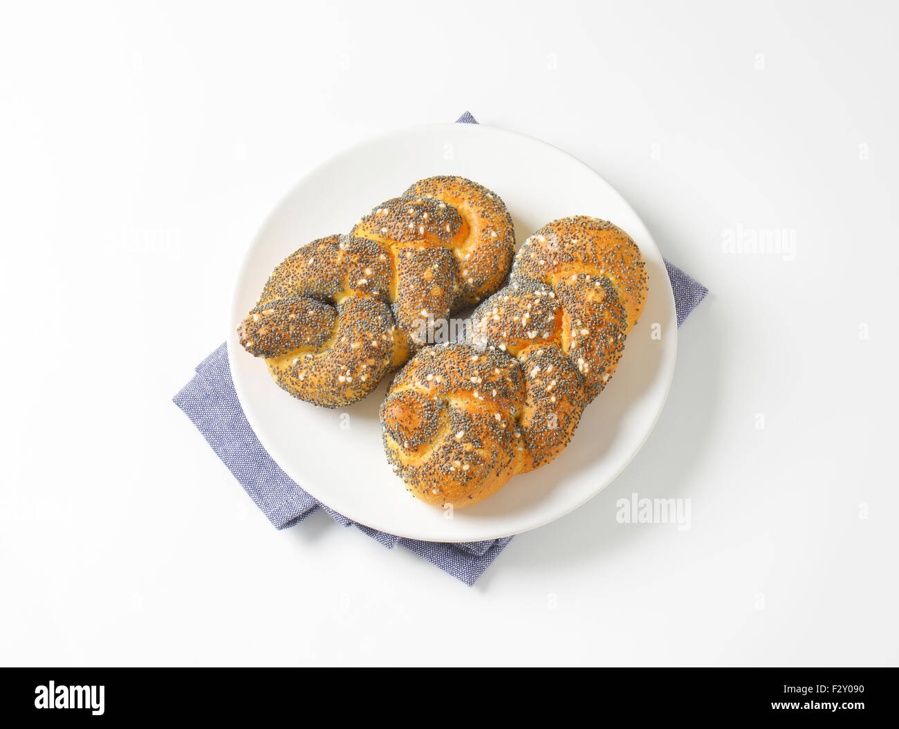Braided bread rolls topped with poppy seeds and salt Stock Photo - Alamy