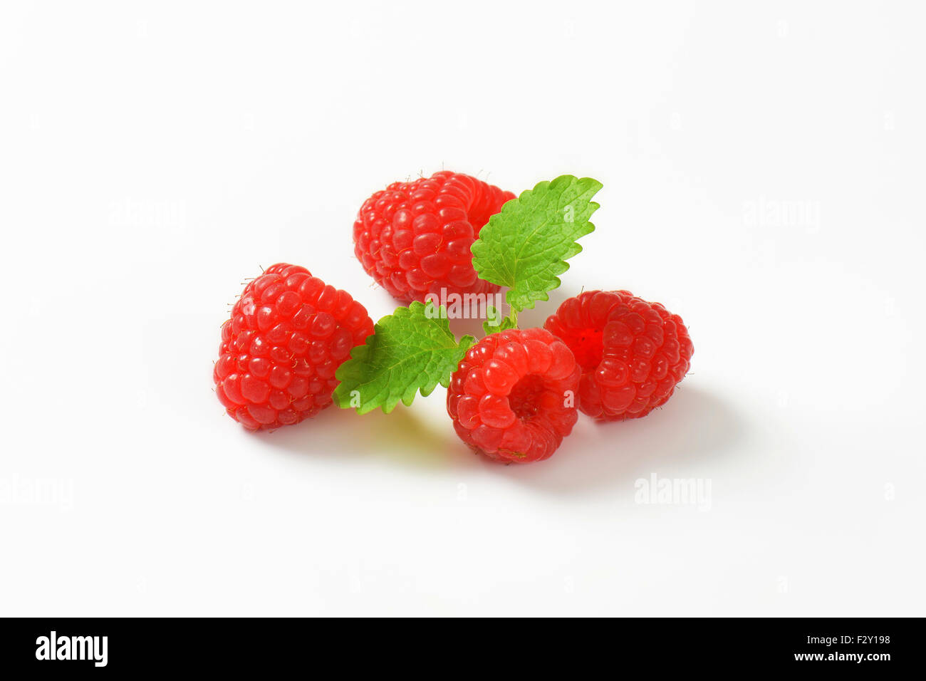 Fresh raspberries on white background Stock Photo - Alamy