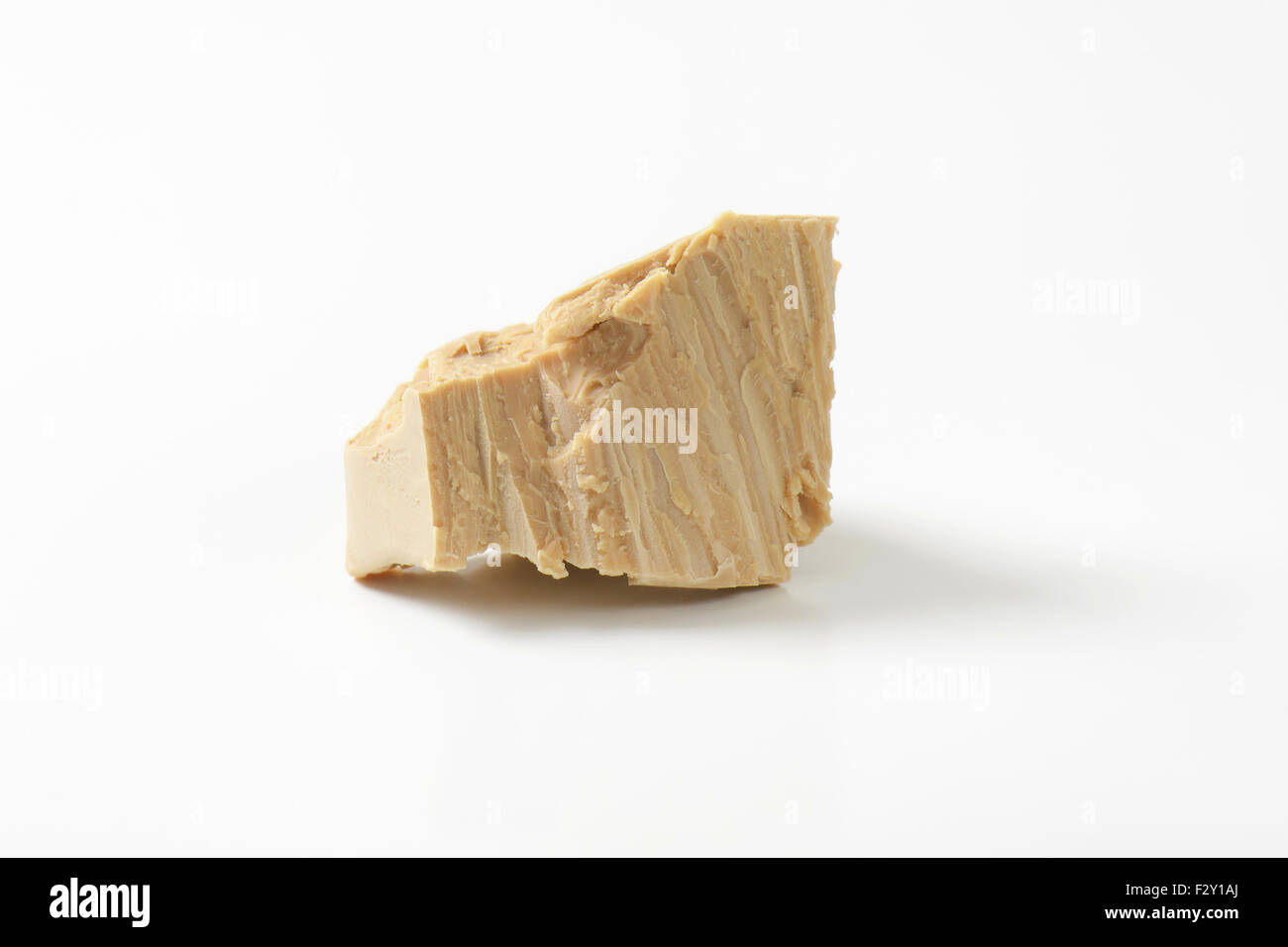 Piece of compressed fresh yeast Stock Photo - Alamy