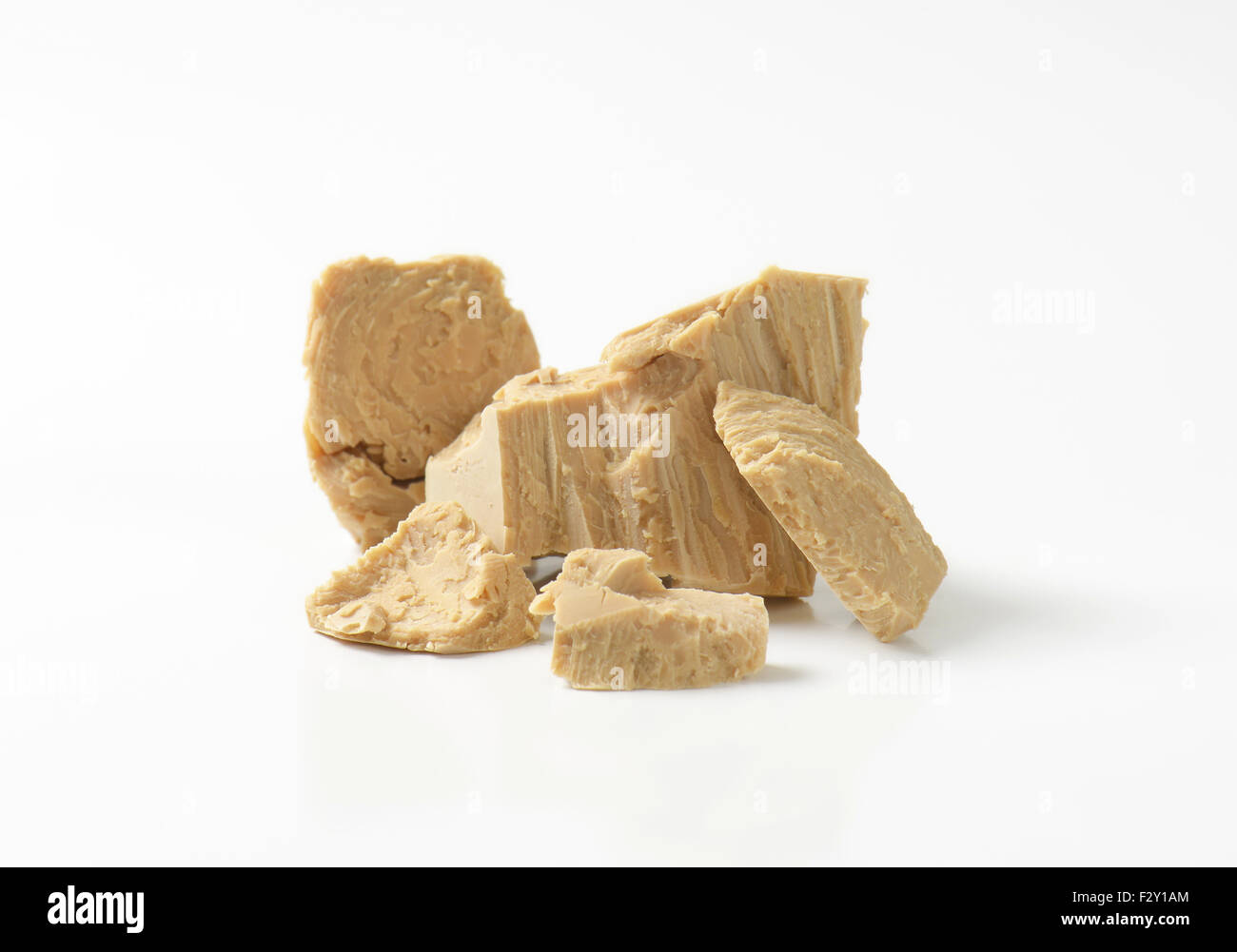 Pieces of compressed fresh yeast Stock Photo - Alamy