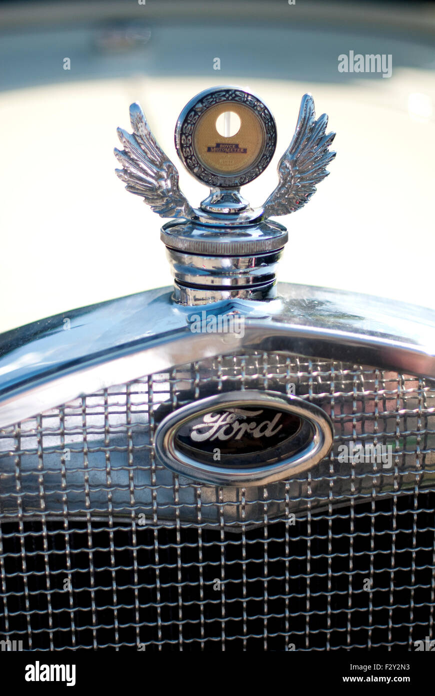 close up of a Winged Motor Car Hood Ornament and Emblem on a vintage ...