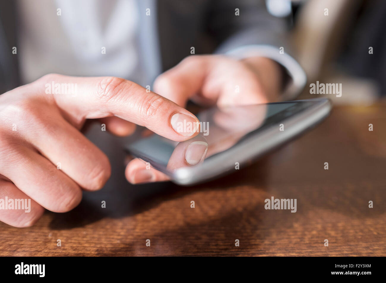 Close-up hands man using cell phone Stock Photo - Alamy