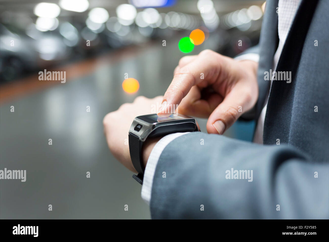 In parking car a man using his smartwatch. Close-up hands Stock Photo ...