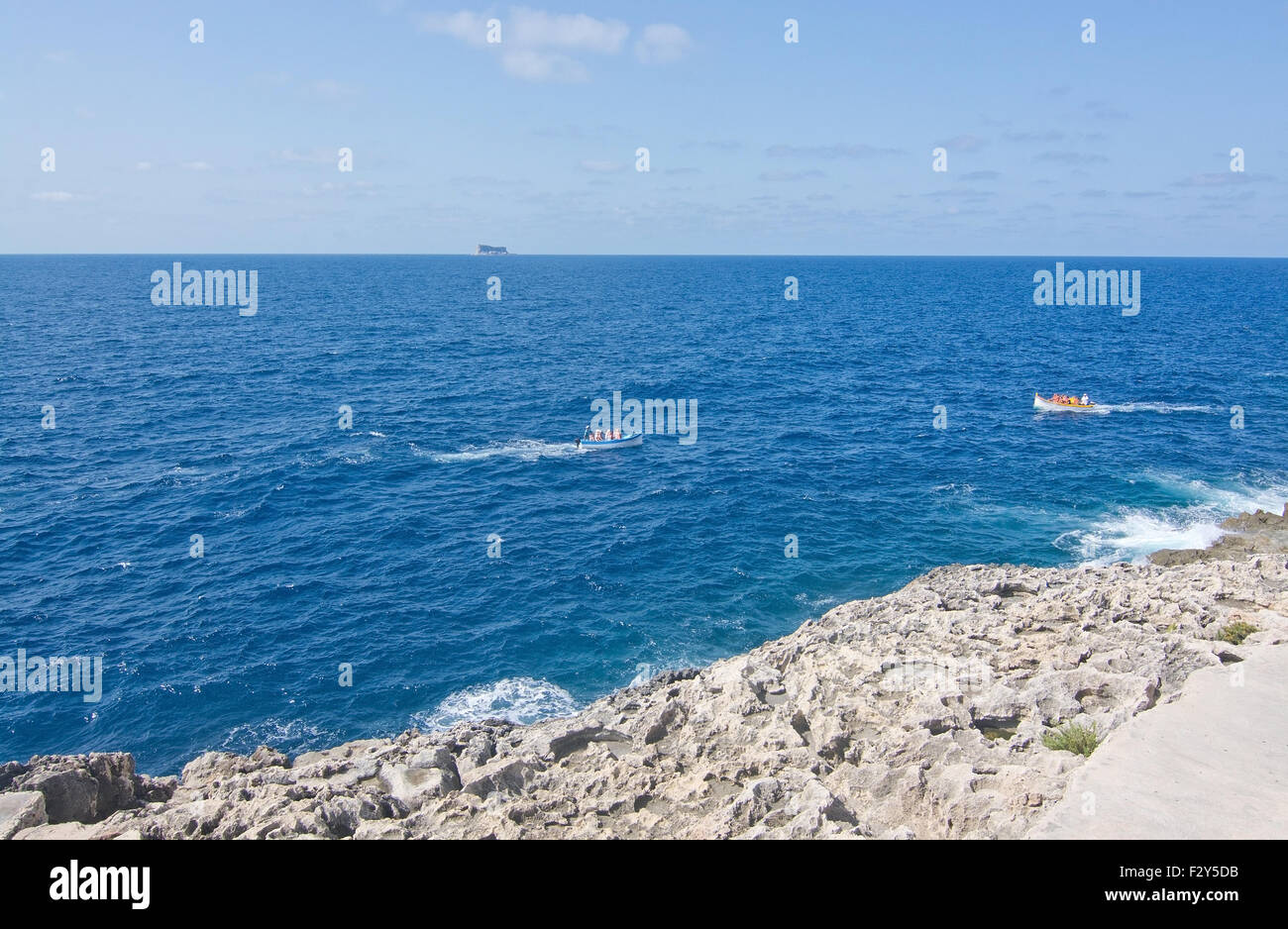 Tour boats at sea and bird protection area island Filfla in the popular ...