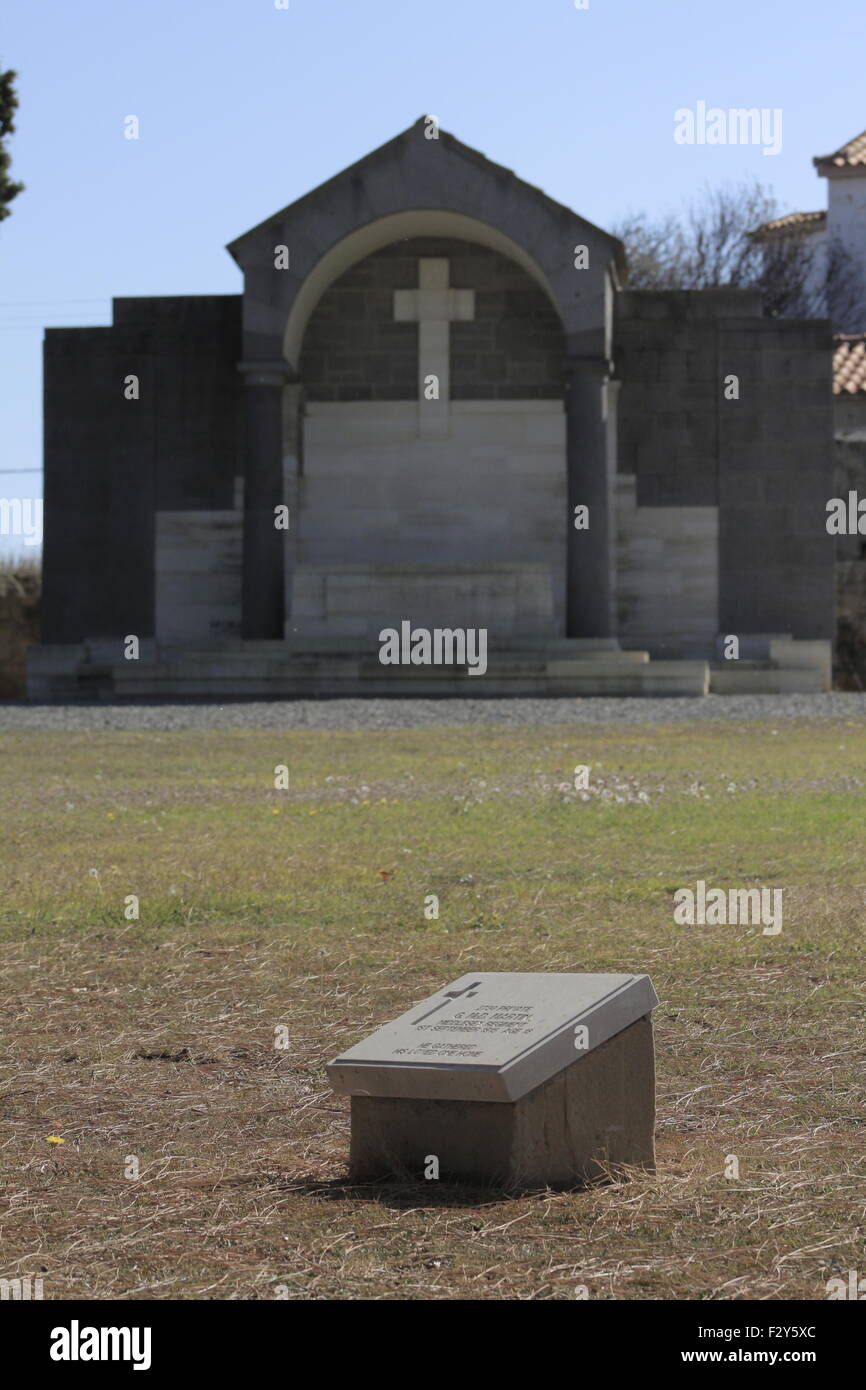 Single tombstone facing the Great Cross cove memorial in the background ...