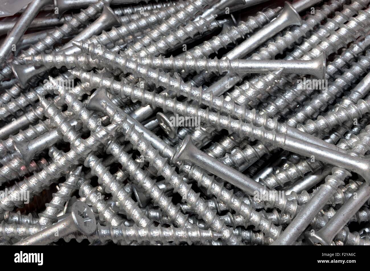 Building screws, metallic colored hardware Stock Photo - Alamy